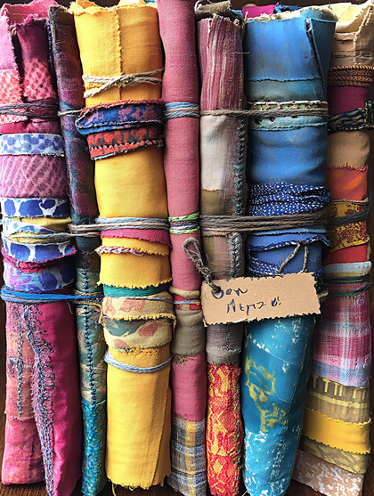 Free Download Colorful Textile Fabric Rolls Bundled Together